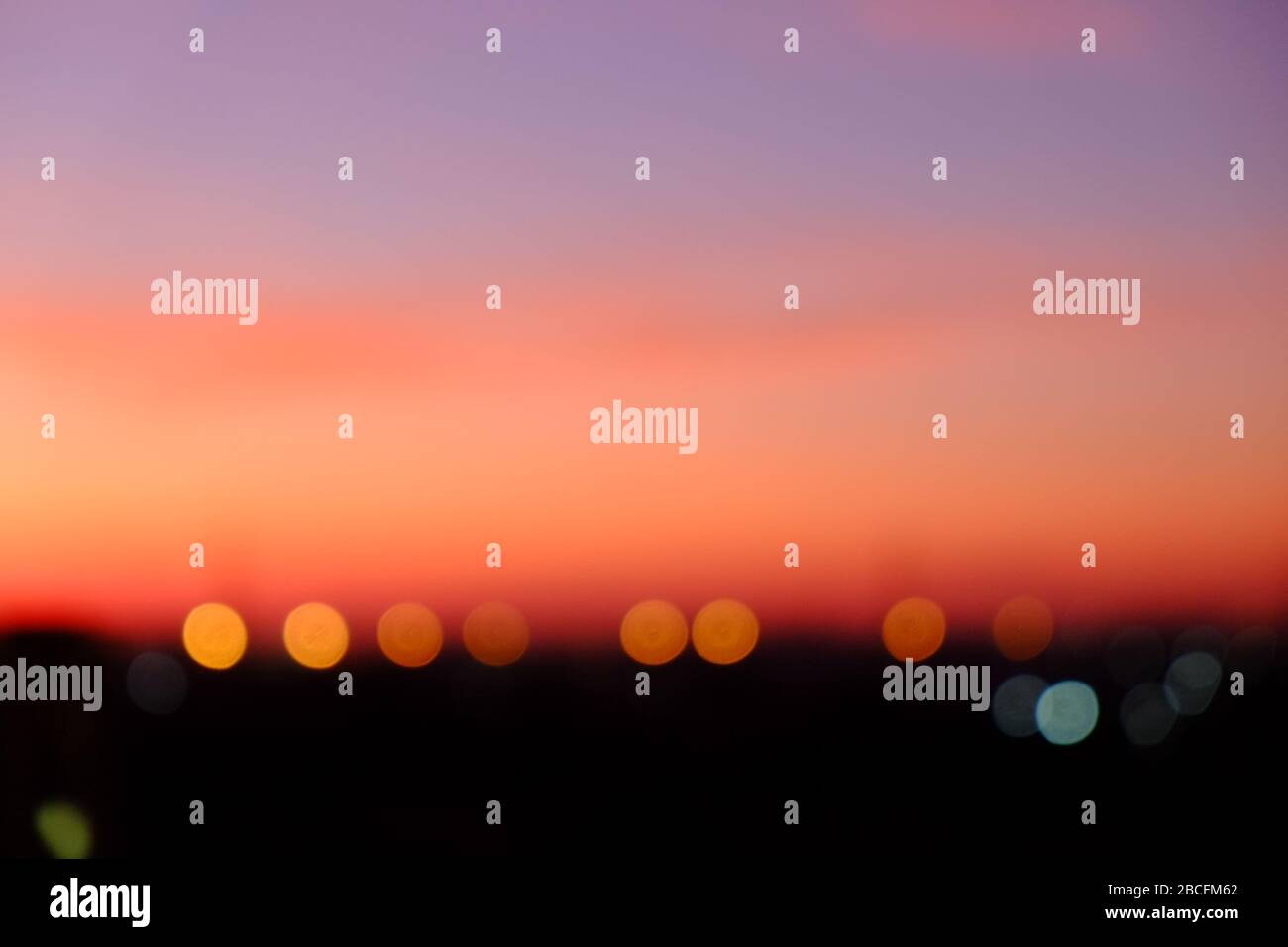 sunset sky shading background from orange to blue with bokeh Stock ...