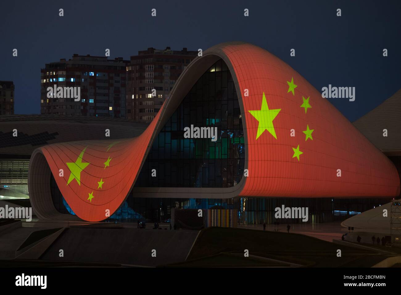 Baku. 4th Apr, 2020. The Heydar Aliyev Center is lit up with the image ...