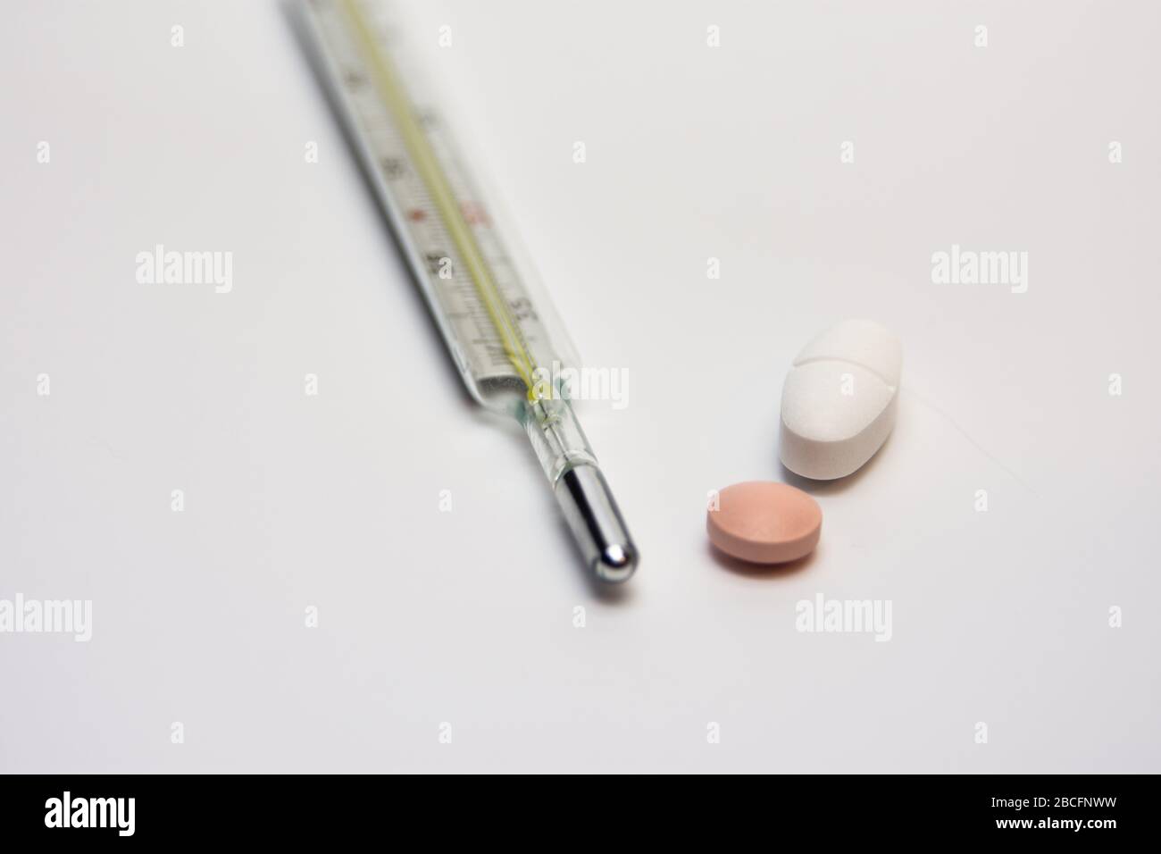 pill packs, industial thermometer with colorful medicaments lying on ...