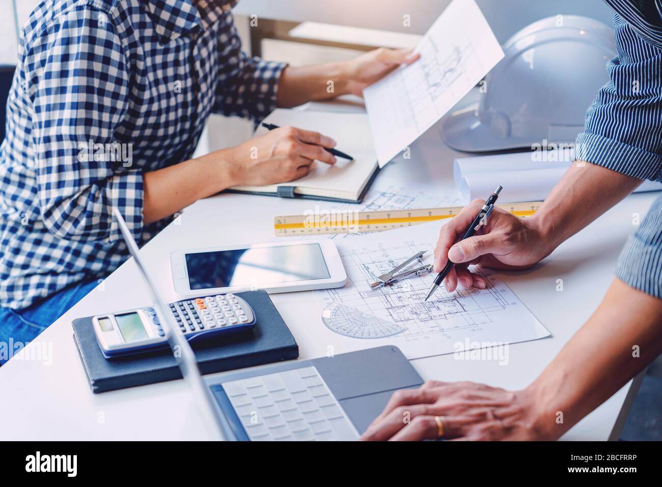 engineer Hand Drawing Plan On Blue Print with architect equipment ...
