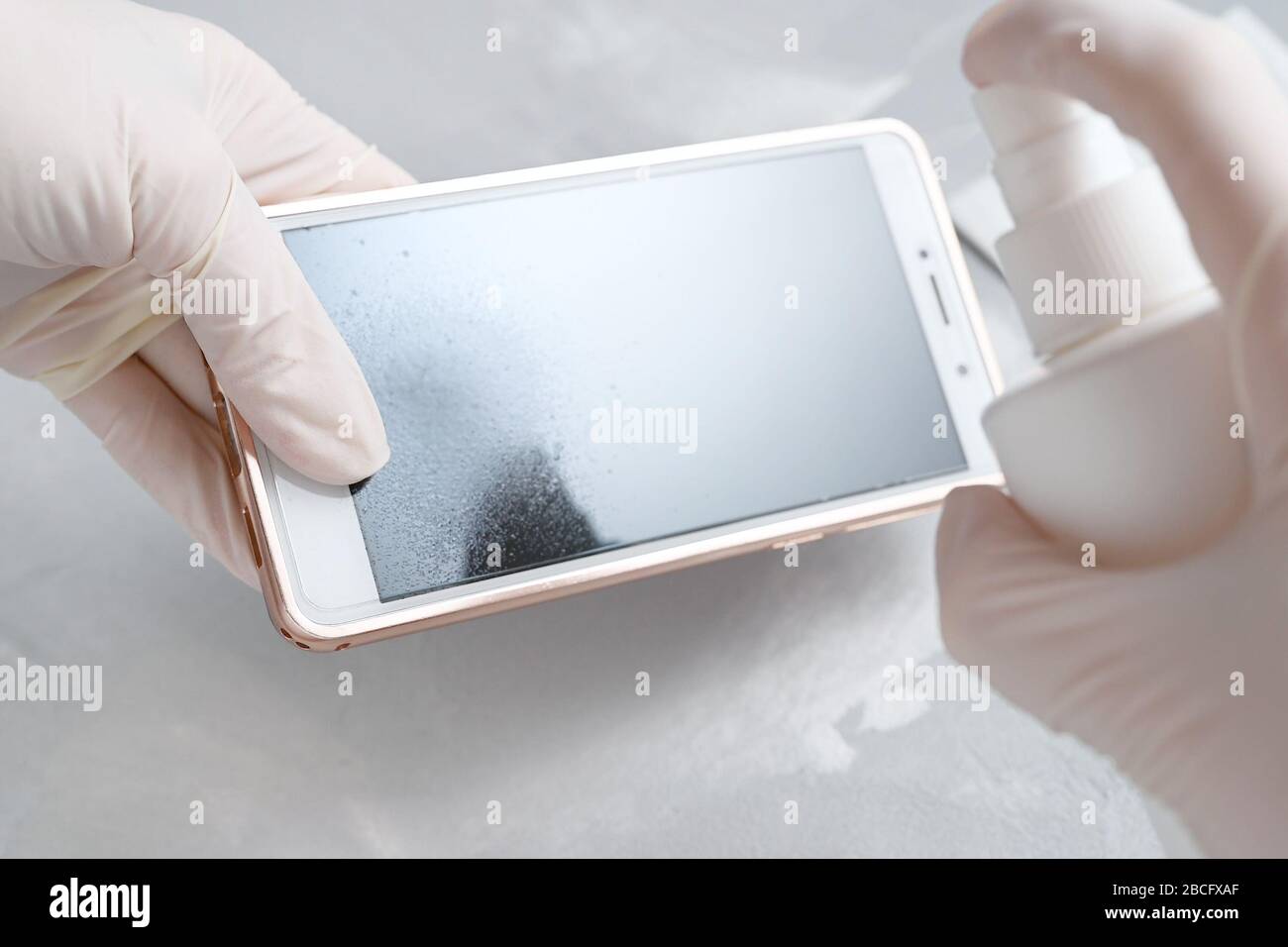 disinfection of mobile phone to prevent coronavirus Stock Photo - Alamy