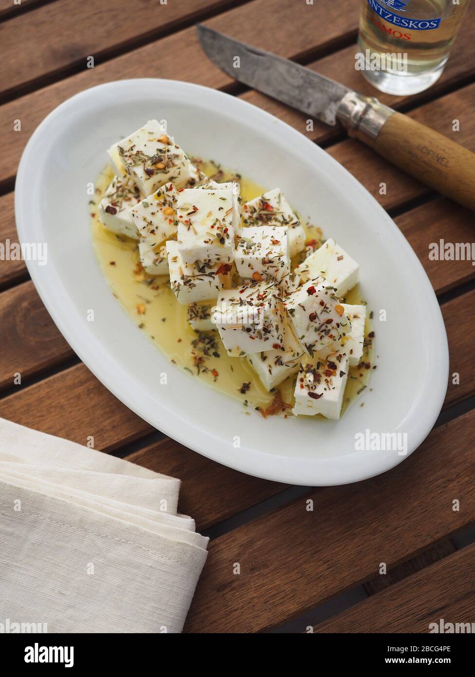 Greek feta cheese cut into cubes and seasoned with olive oil and ...