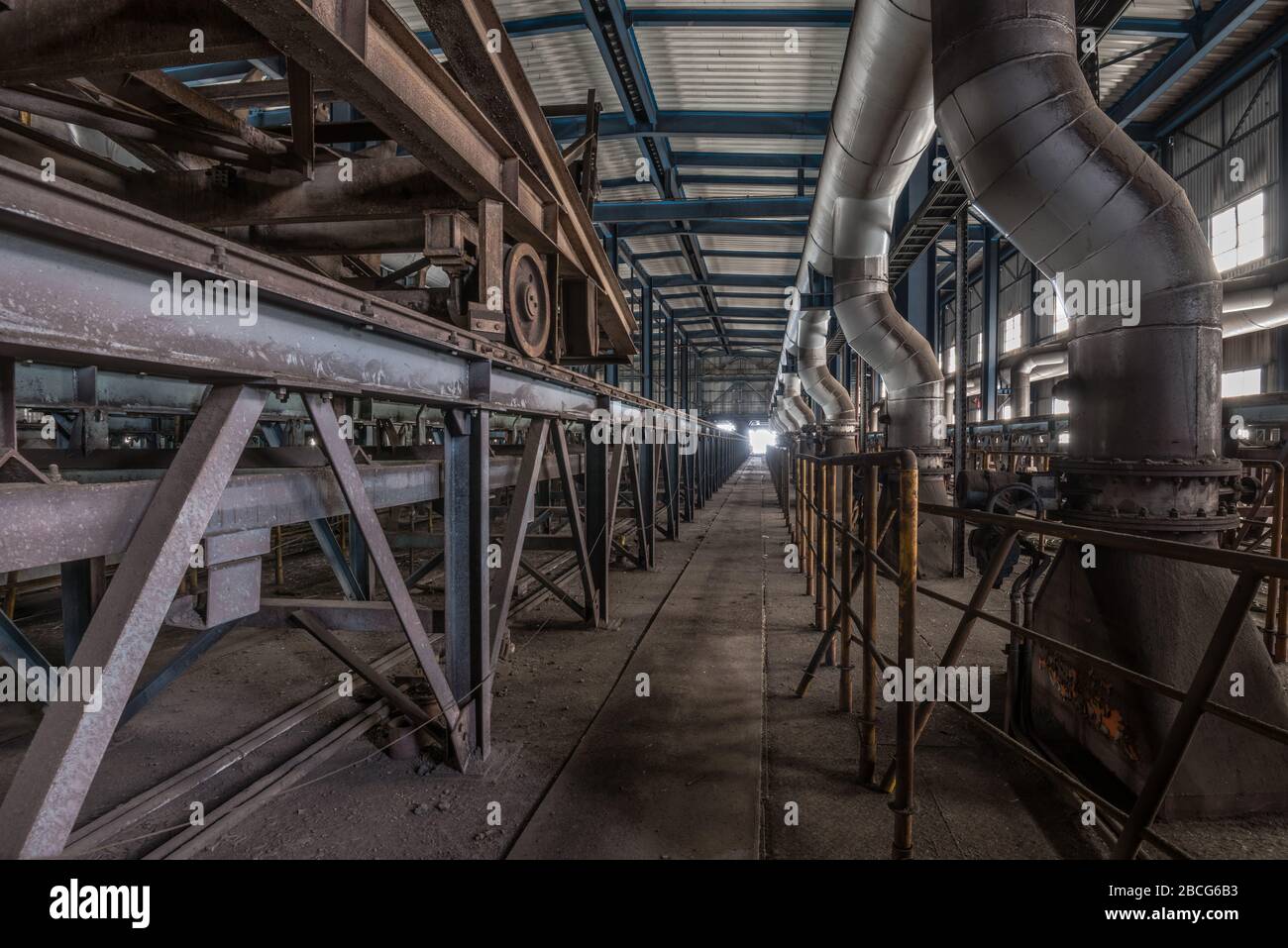 Interior of an old abandoned industrial steel factory Stock Photo - Alamy