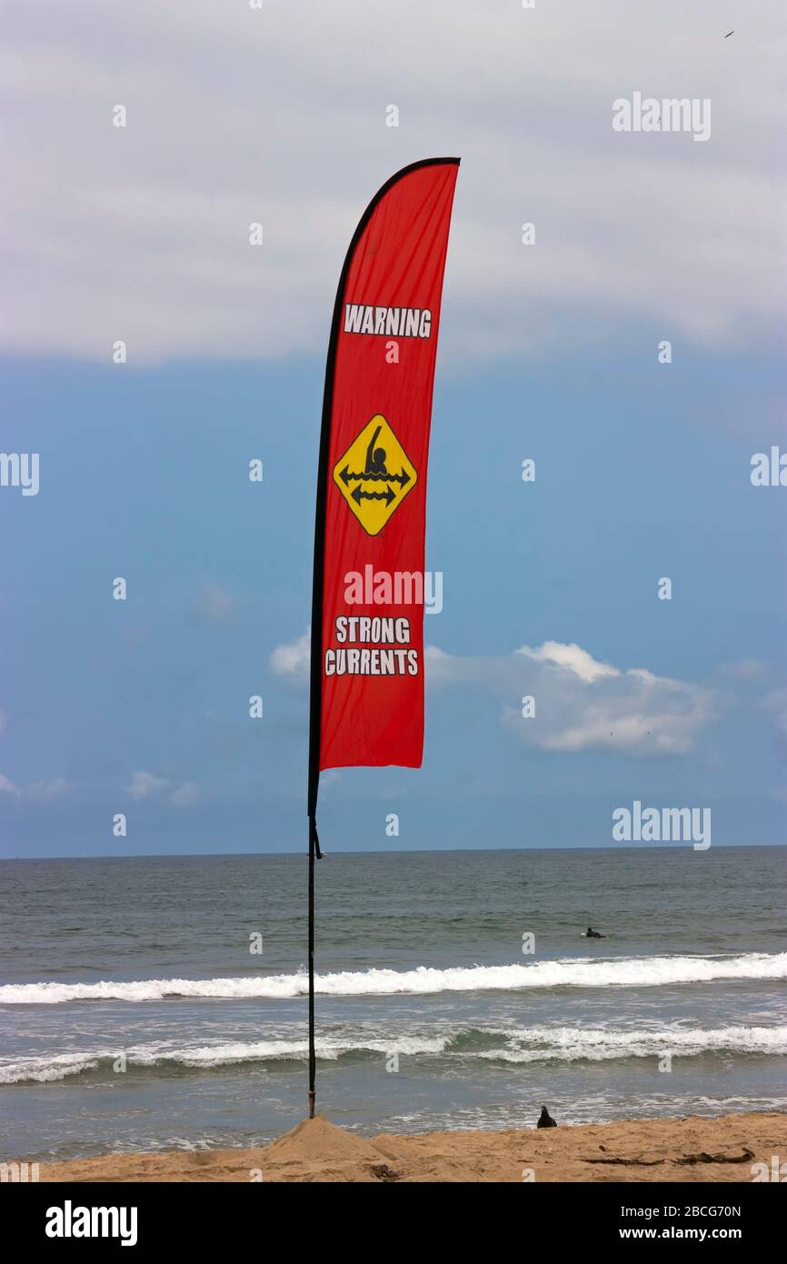 Warning strong currents sign standing on the beach ocean Stock Photo ...