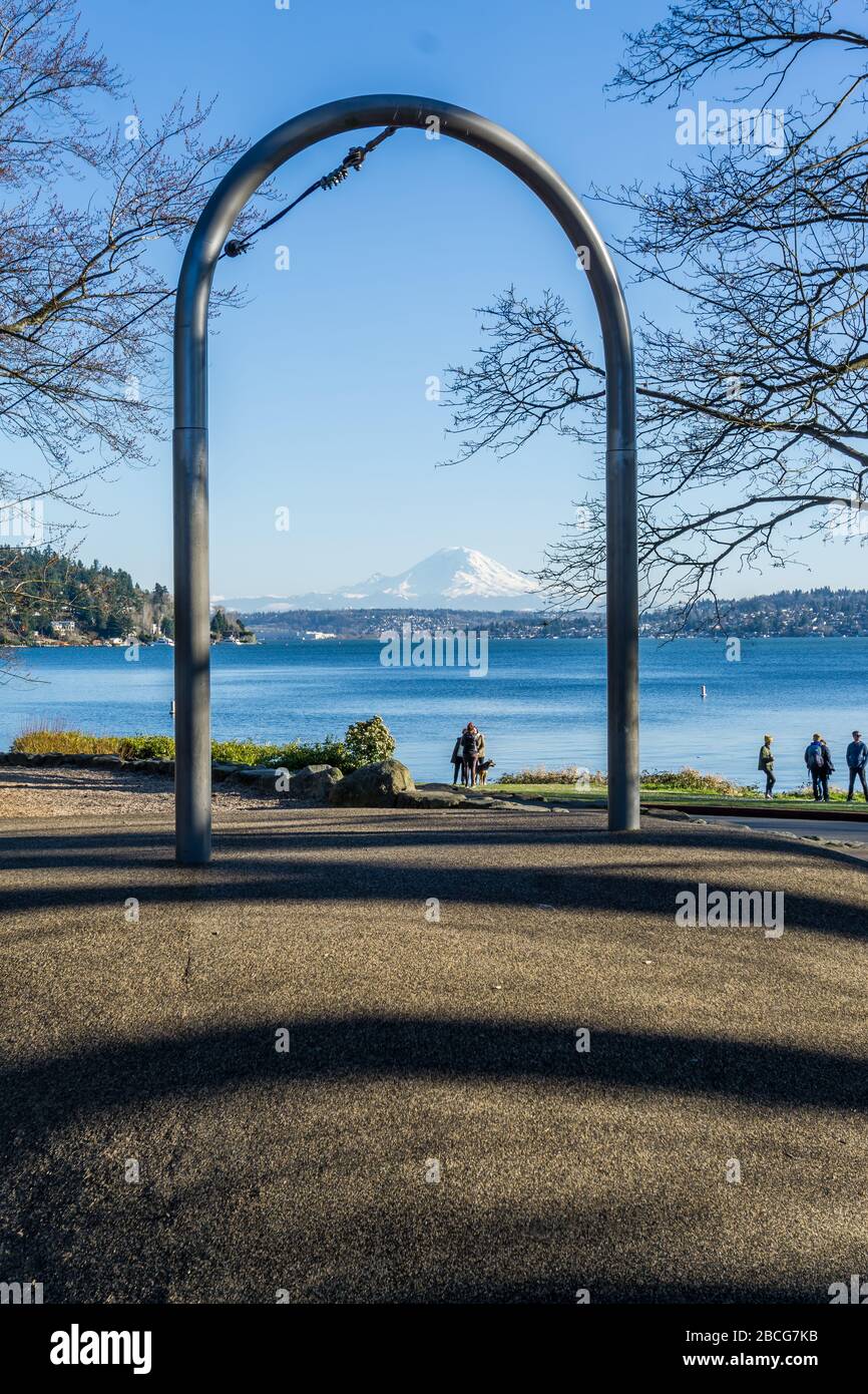 A zip-line frames Mount Rainier at Seward Park in Seattle, Washington ...