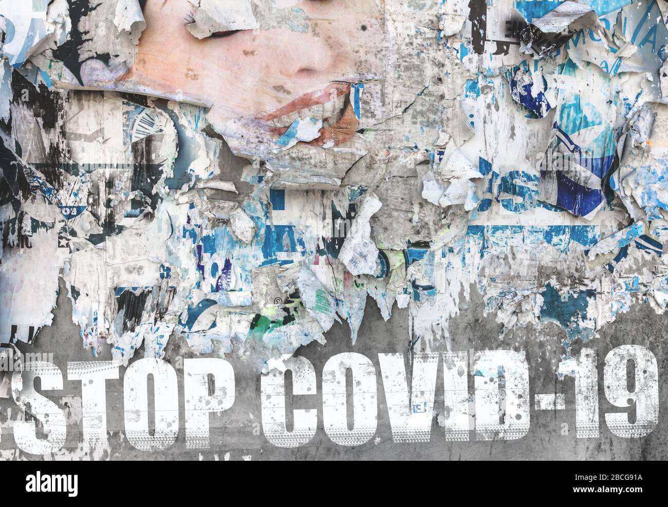 Message "Stop COVID-19" on old torn posters. COVID-19 outbreak ...