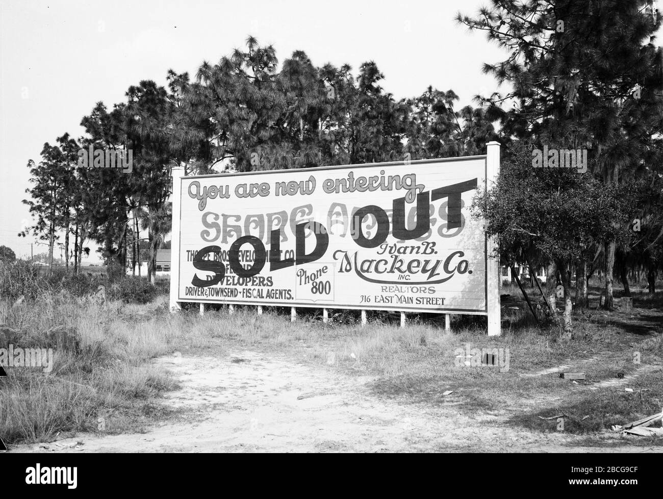 A real estate development billboard with 'Sold Out' over 'You are ...