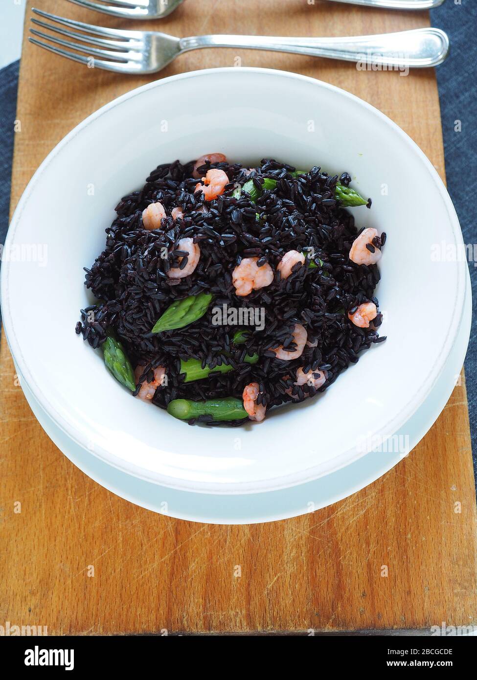 Risotto, Venere black rice with shrips and asparagus, Italy, Europe ...