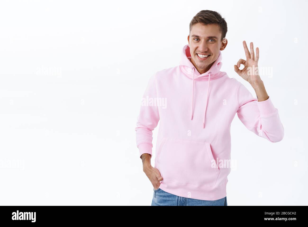 Portrait of happy, satisfied male customer, guy with blond hair look ...