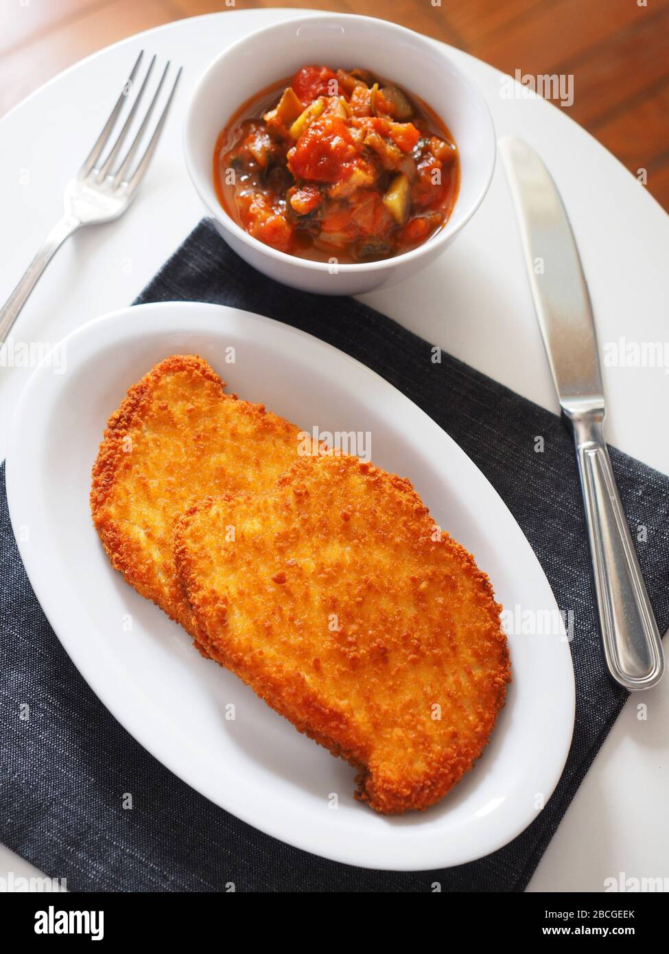 Swordfish breaded cutlet with ratatouille, Italy, Europe Stock Photo ...