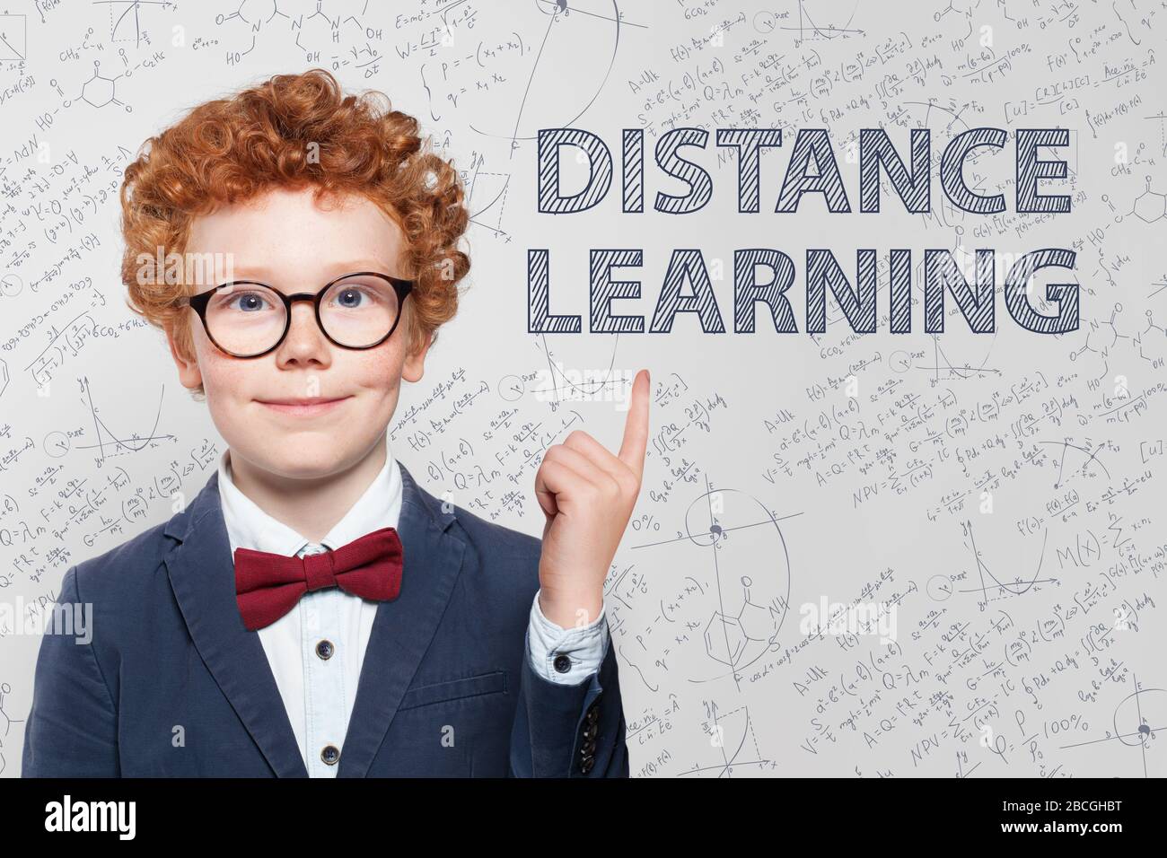 Distance education and pointing schoolboy kid on white background Stock ...