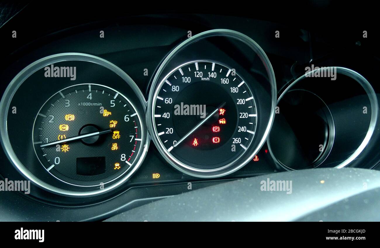 Close up glowing tachometer needle on zero engine speed on the car ...