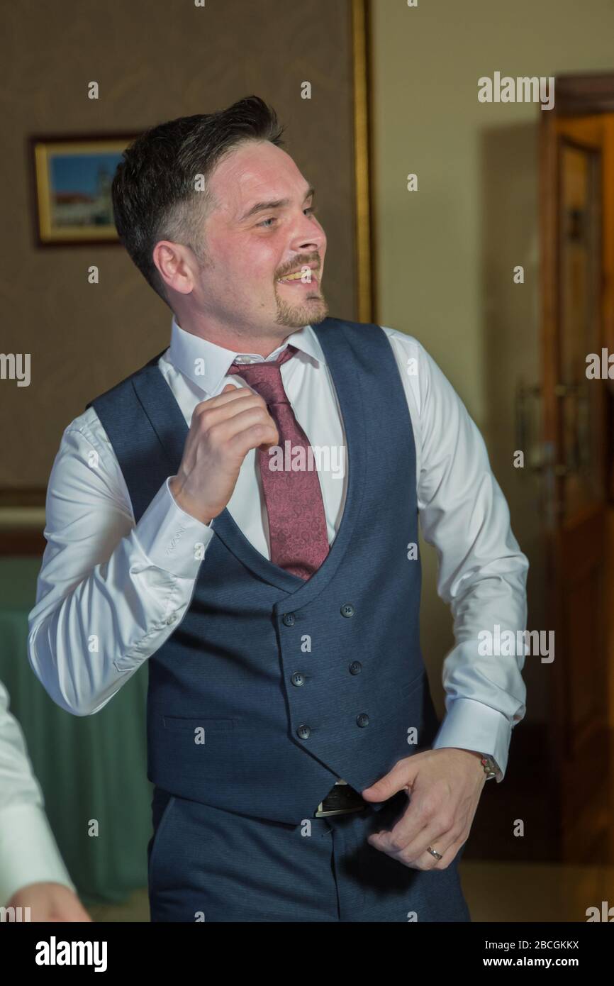 Happy handsome groom dancing having fun at reception . groom having fun ...