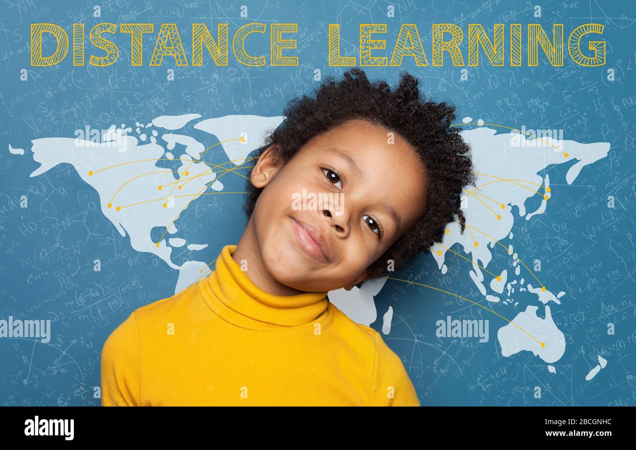 Happy smart African American child boy against World map. Distance ...
