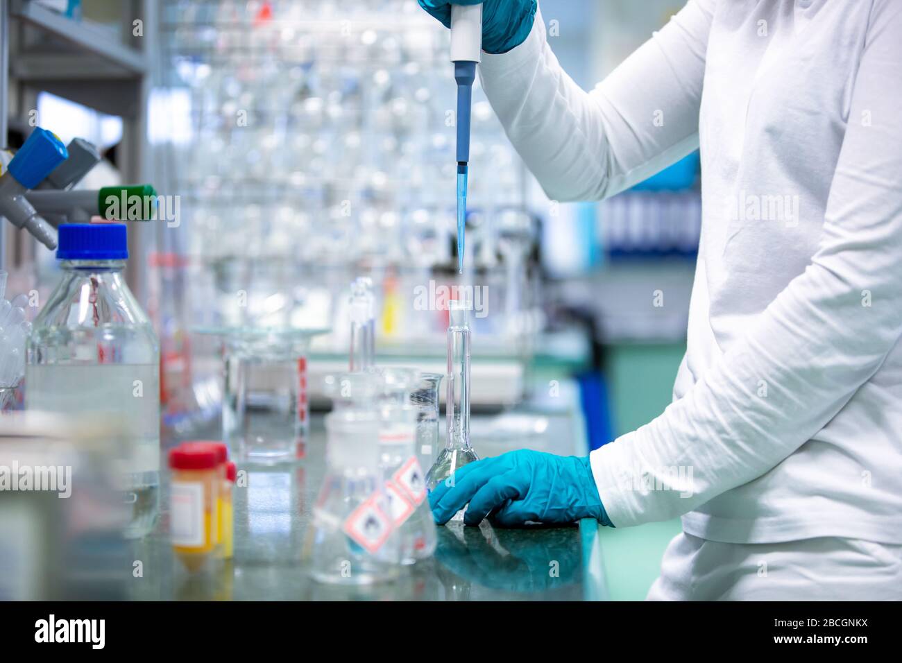 Female researcher, developer doing research, experiments in chemistry ...