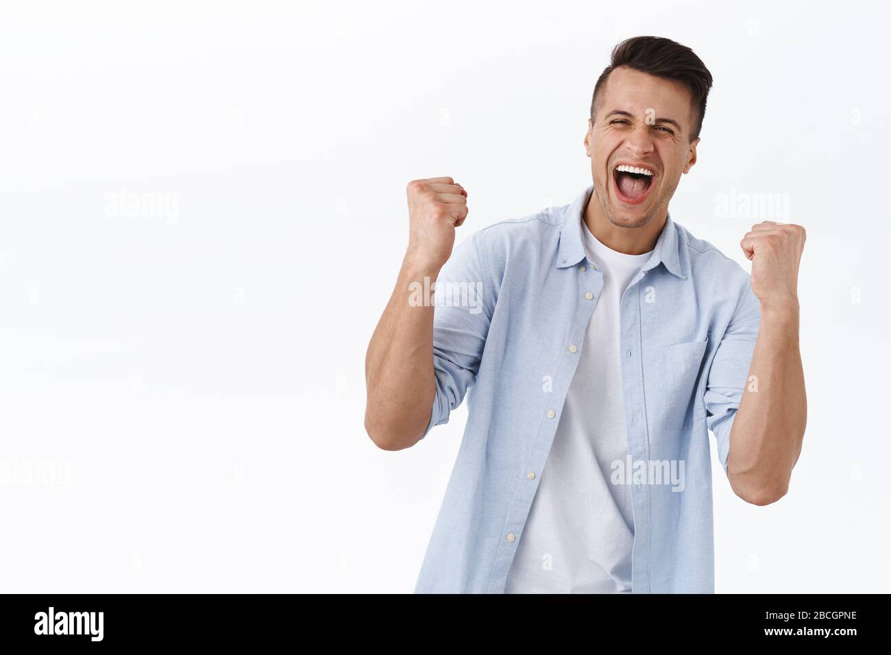 Congratulation and celebration, people concept. Rejoicing handsome man ...