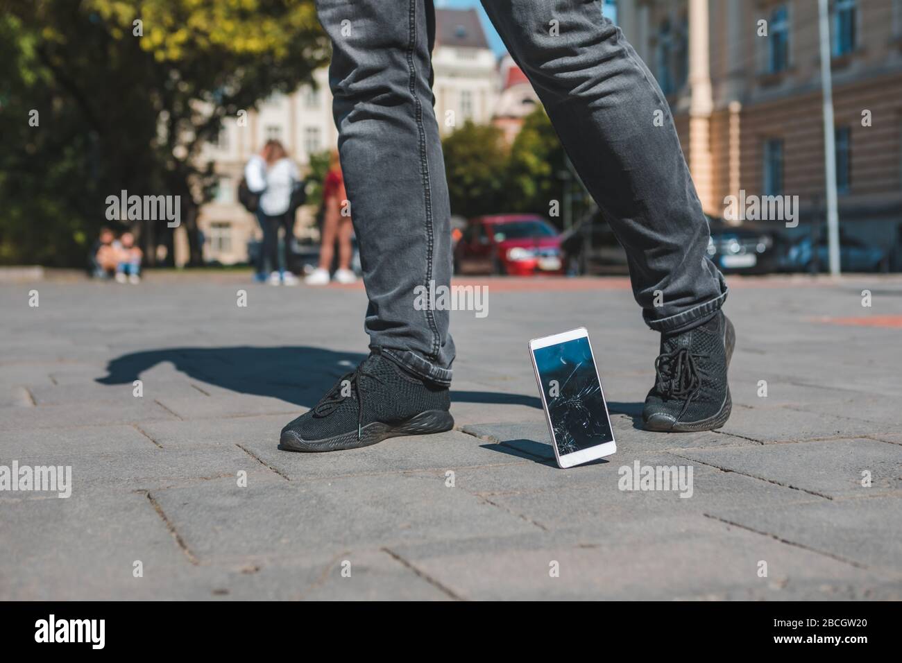 drop down mobile phone cracked screen Stock Photo - Alamy