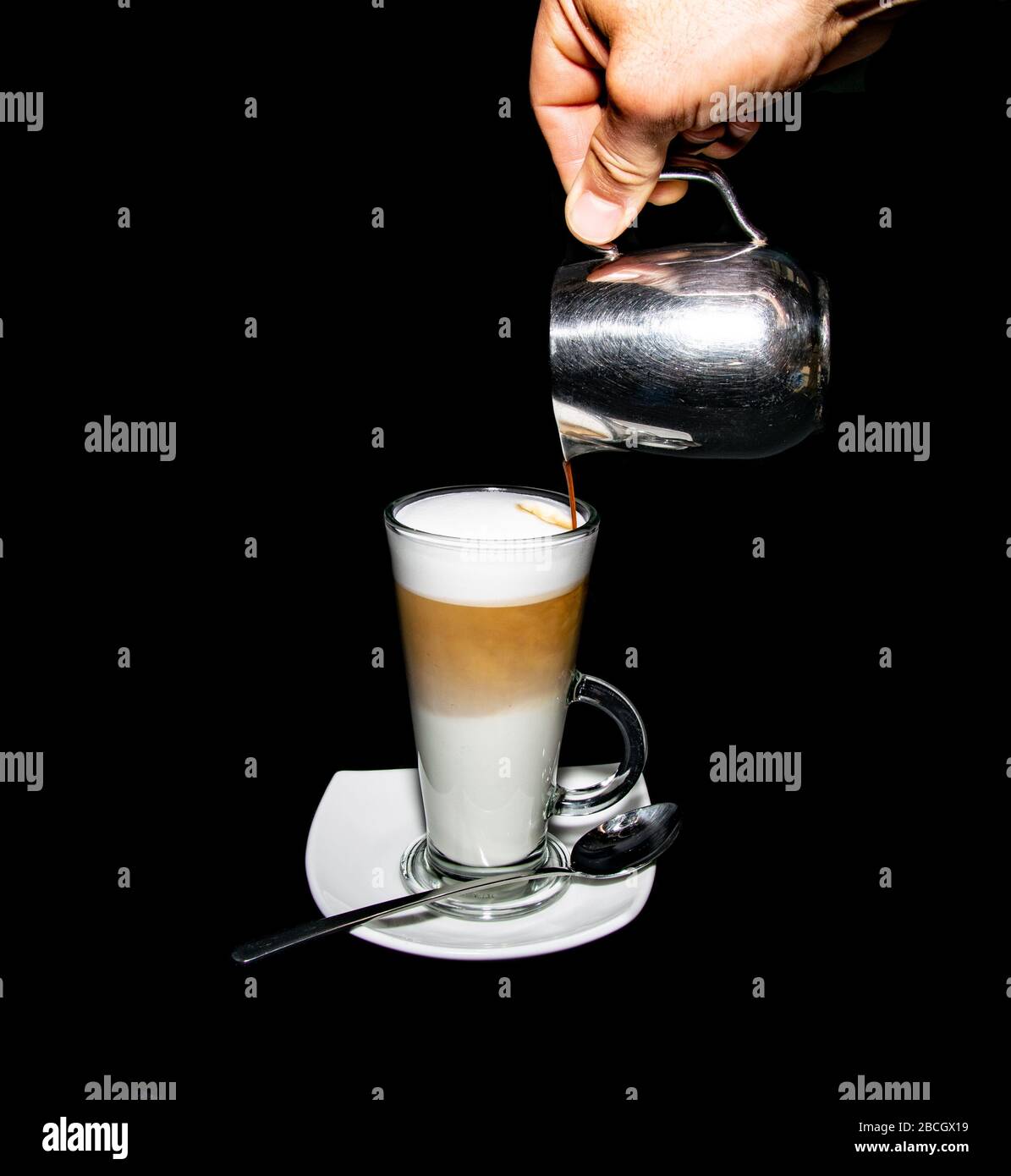 the pouring of a floating latte coffee by me Stock Photo - Alamy