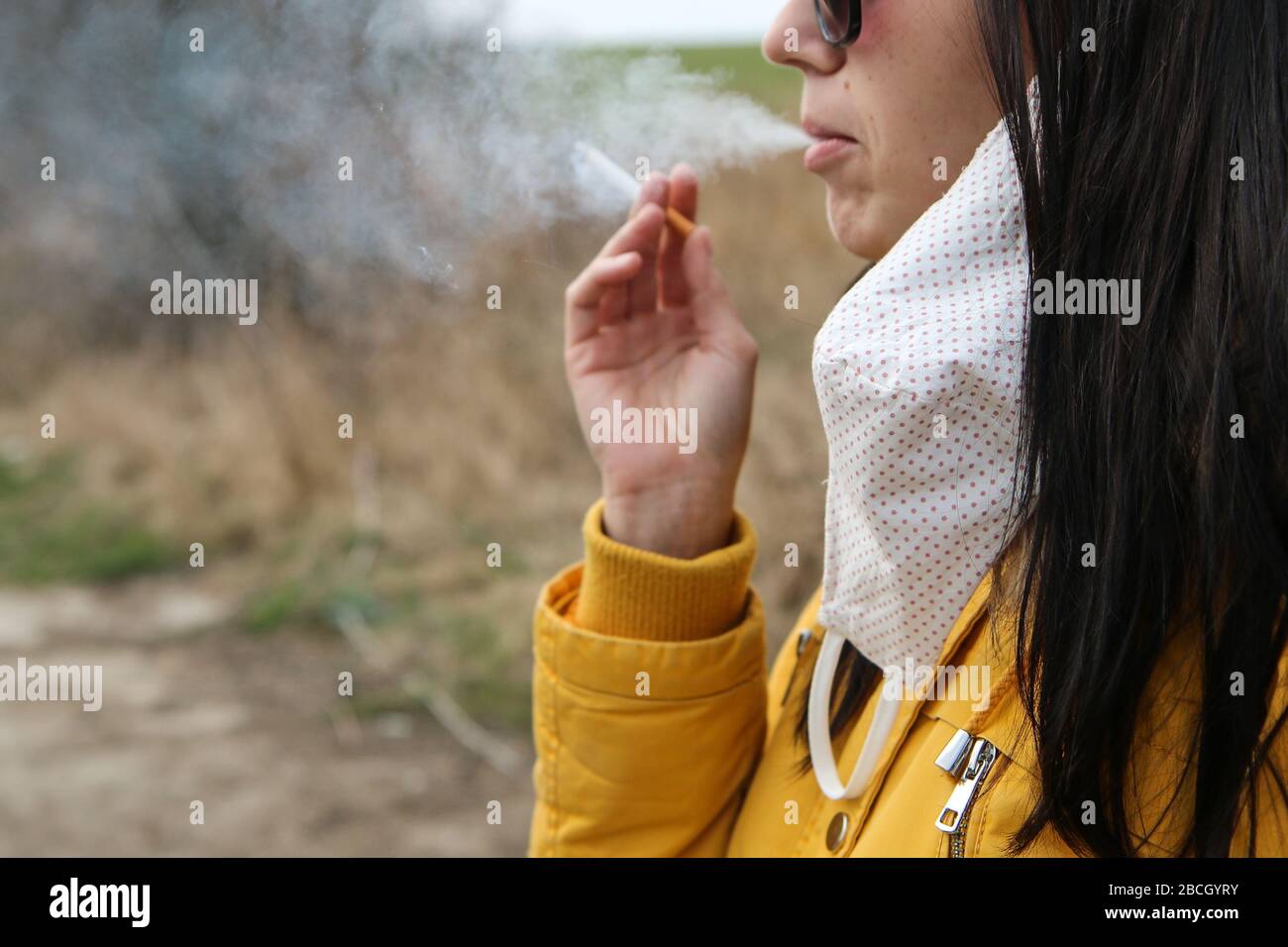 Woman smoking cigarette home hi-res stock photography and images - Alamy