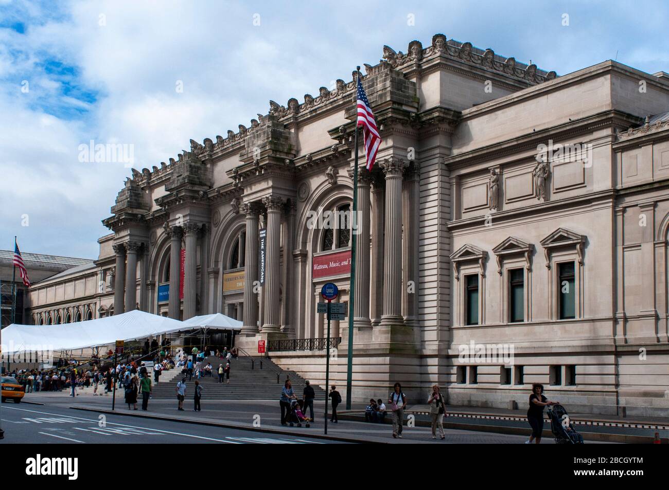 Daytime front view of the Metropolitan Museum of Art with tourists ...