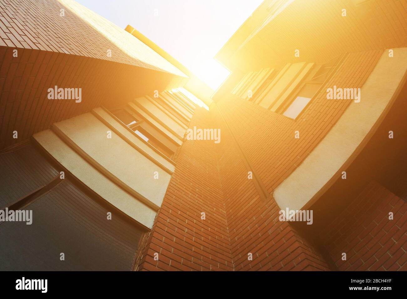 Residential building from below wide angle sunny Stock Photo - Alamy