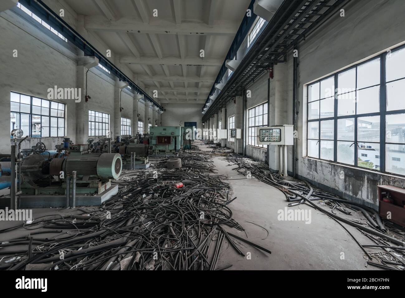 Interior of an old abandoned industrial steel factory Stock Photo - Alamy
