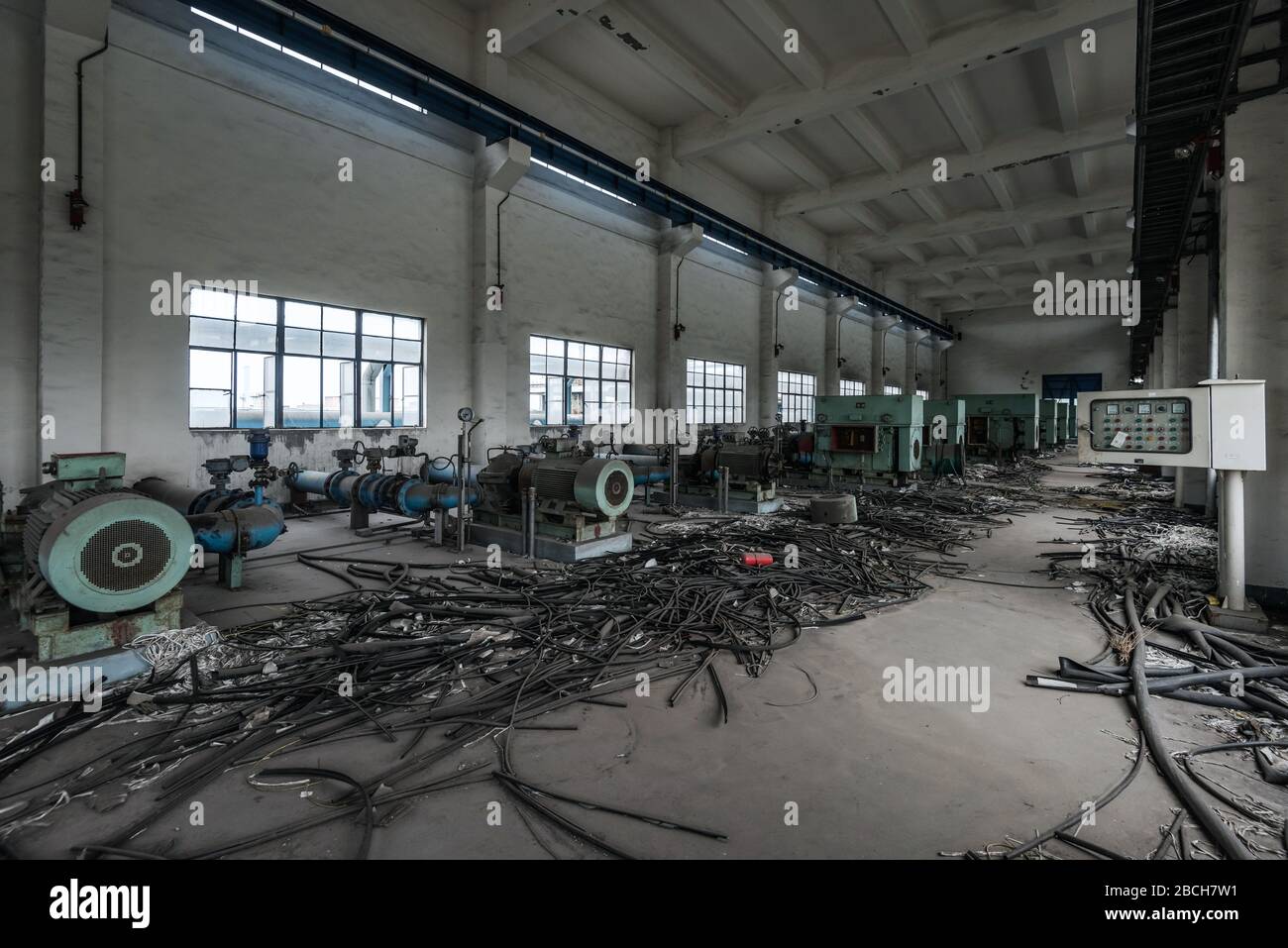Interior of an old abandoned industrial steel factory Stock Photo - Alamy