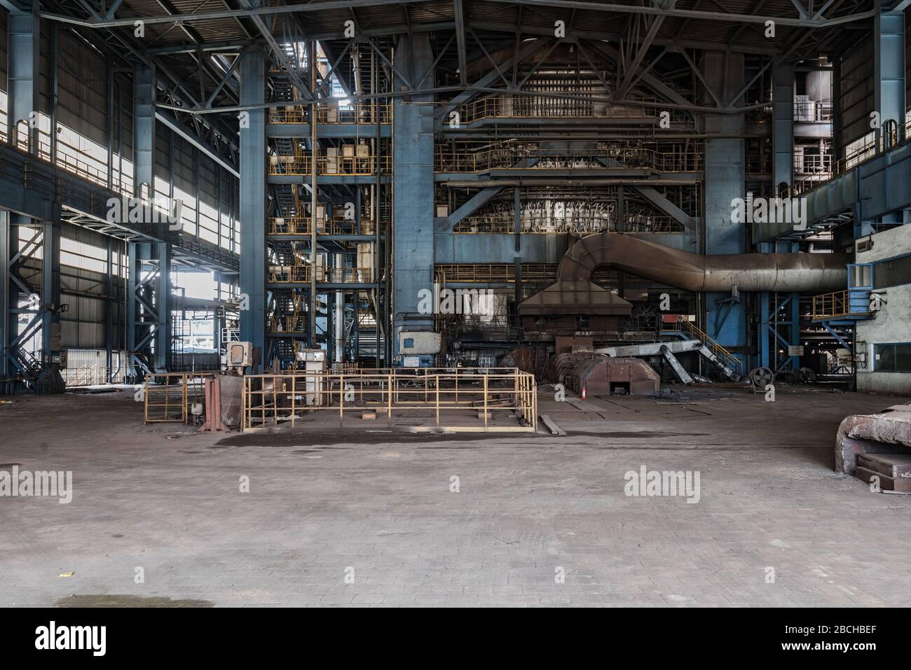Interior of an old abandoned industrial steel factory Stock Photo - Alamy
