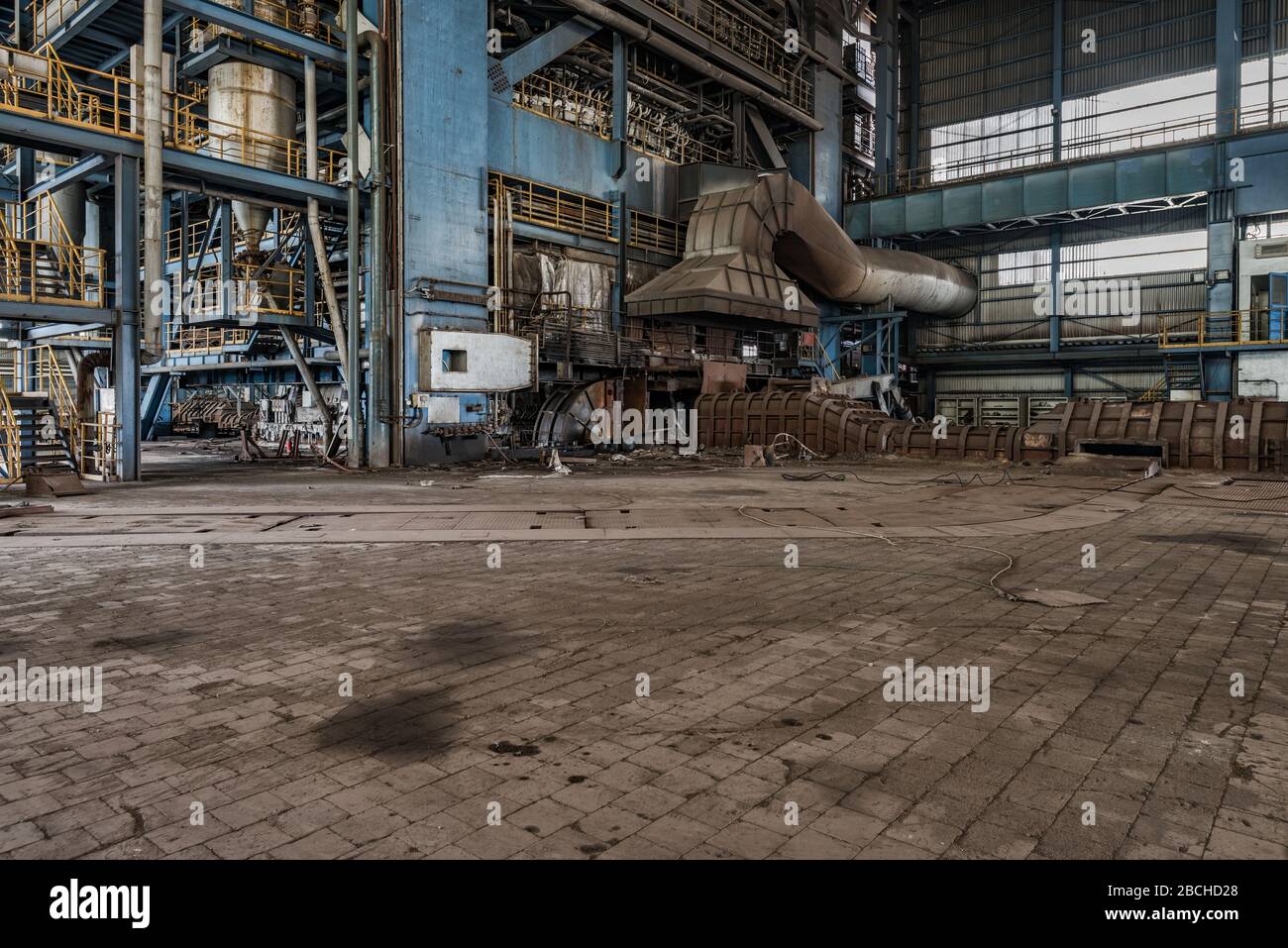 Interior of an old abandoned industrial steel factory Stock Photo - Alamy