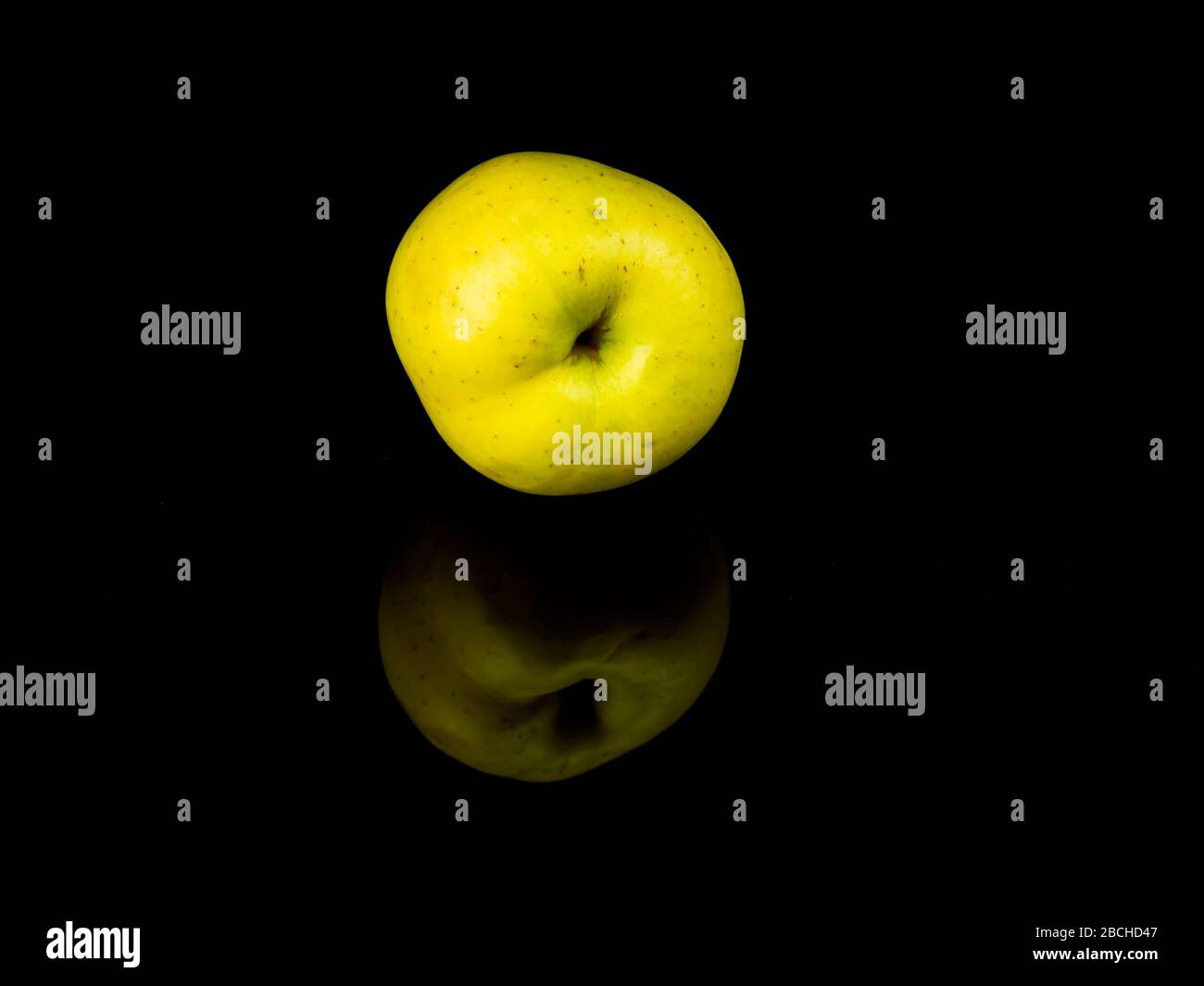 Green apple fruit on a black glass background with reflection Stock ...
