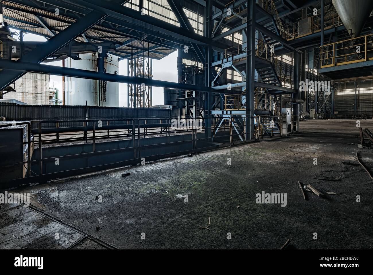 Interior of an old abandoned industrial steel factory Stock Photo - Alamy
