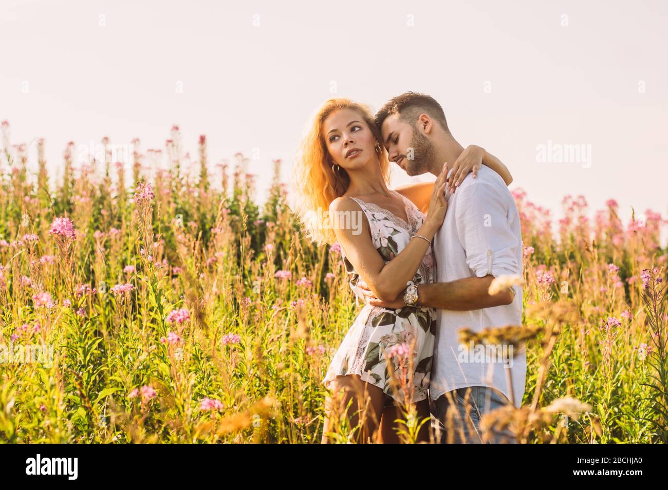 Adult family hugging sunset hi-res stock photography and images - Alamy