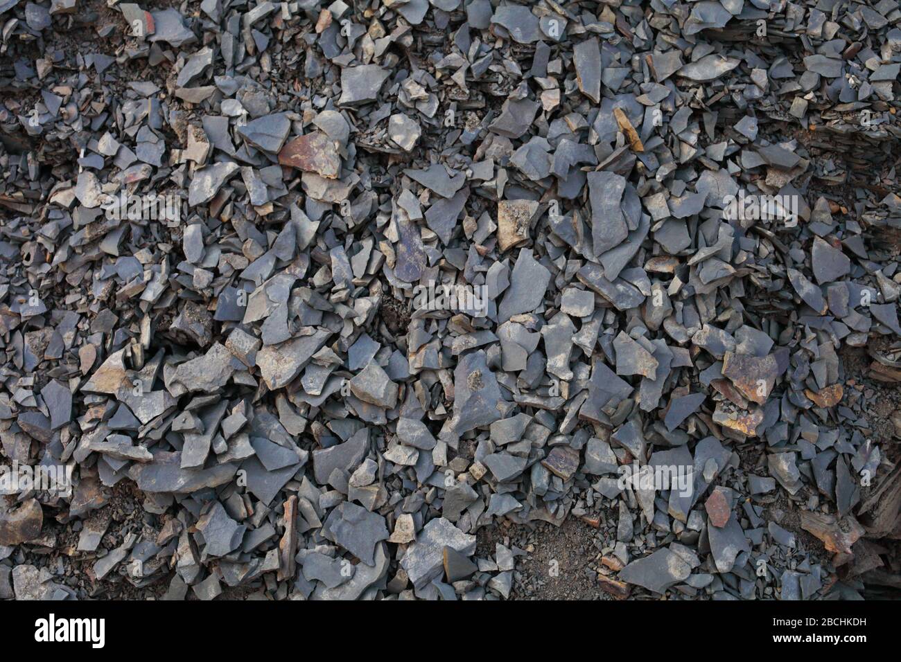 small natural pebbles crumbled from a cliff, background texture Stock ...