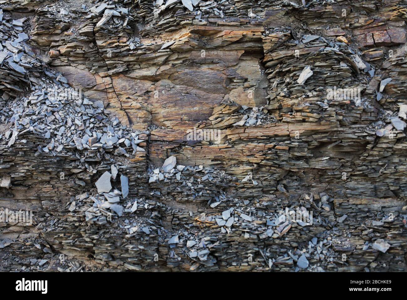 crumbling part of the rock, small stones, background, texture Stock ...