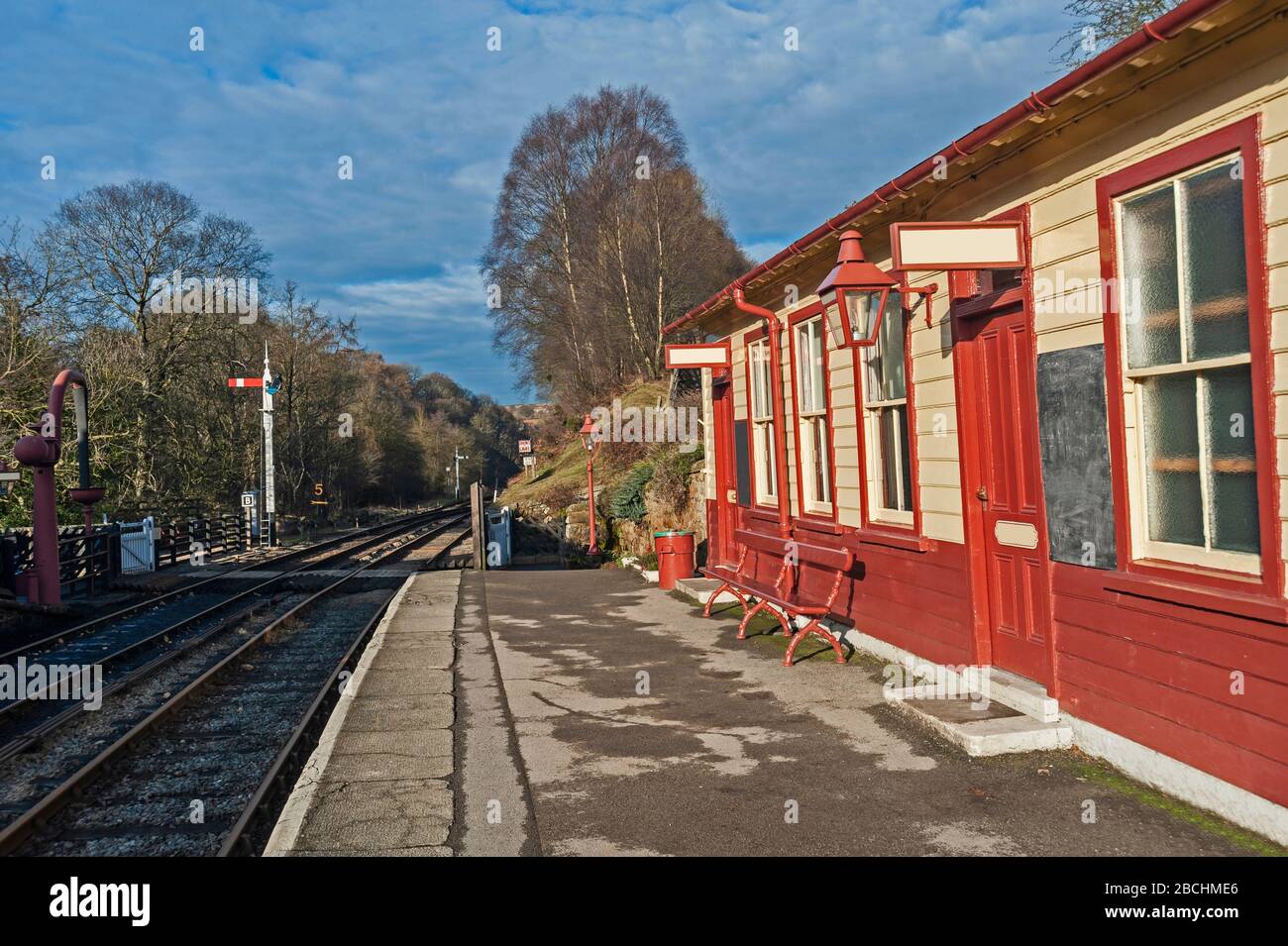 View down the tracks at an old countryside village train station Stock ...