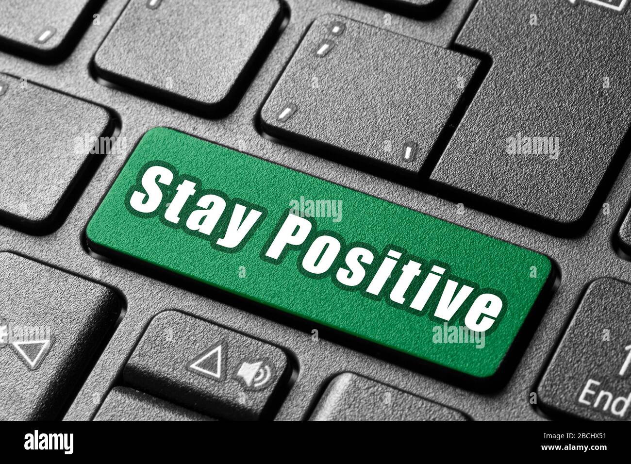 stay positive pc keyboard button pushing a single word Stock Photo - Alamy