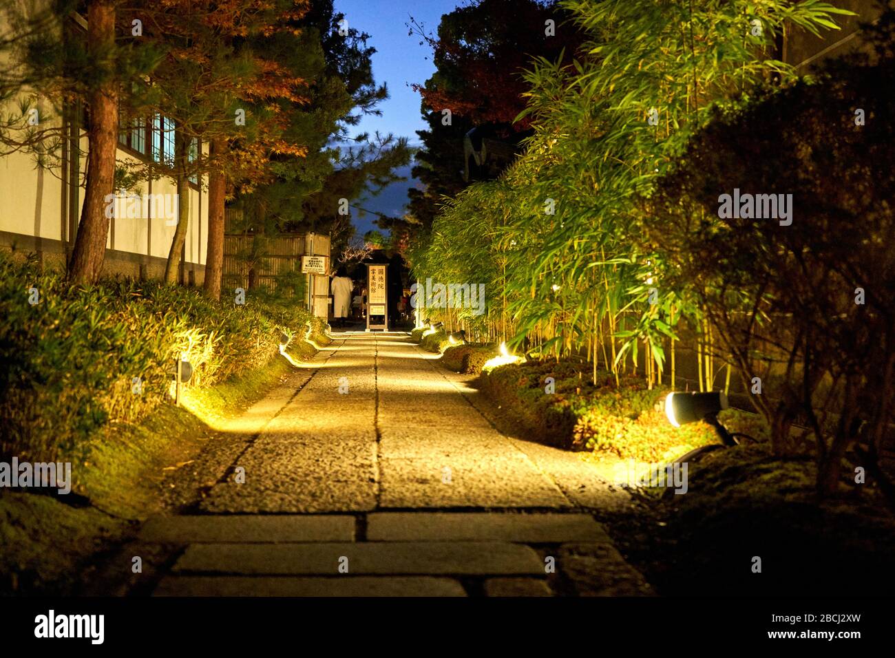 Nicely illuminated path in the garden Stock Photo - Alamy