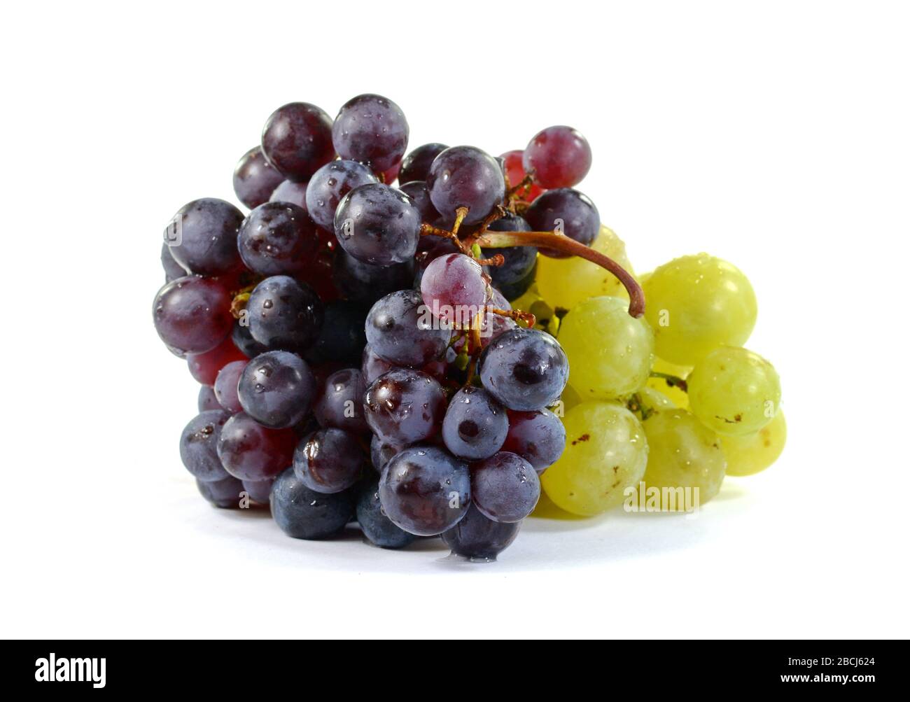 A bunch of overripe grapes isolated on white background Stock Photo - Alamy