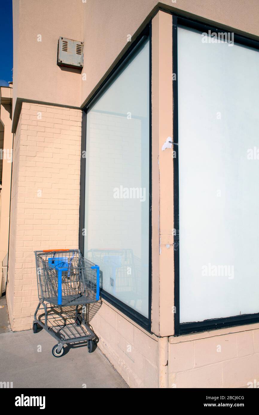 Empty shopping carts outside a large store Stock Photo - Alamy