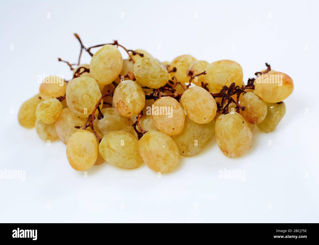 A bunch of overripe grapes isolated on white background Stock Photo - Alamy