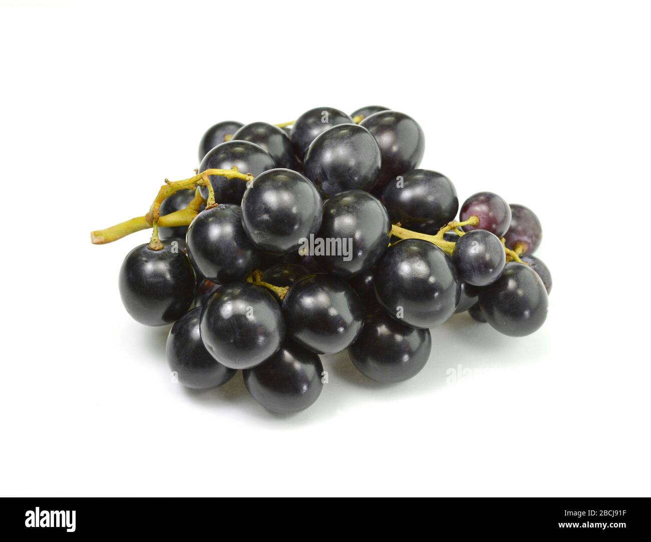 A bunch of overripe grapes isolated on white background Stock Photo - Alamy