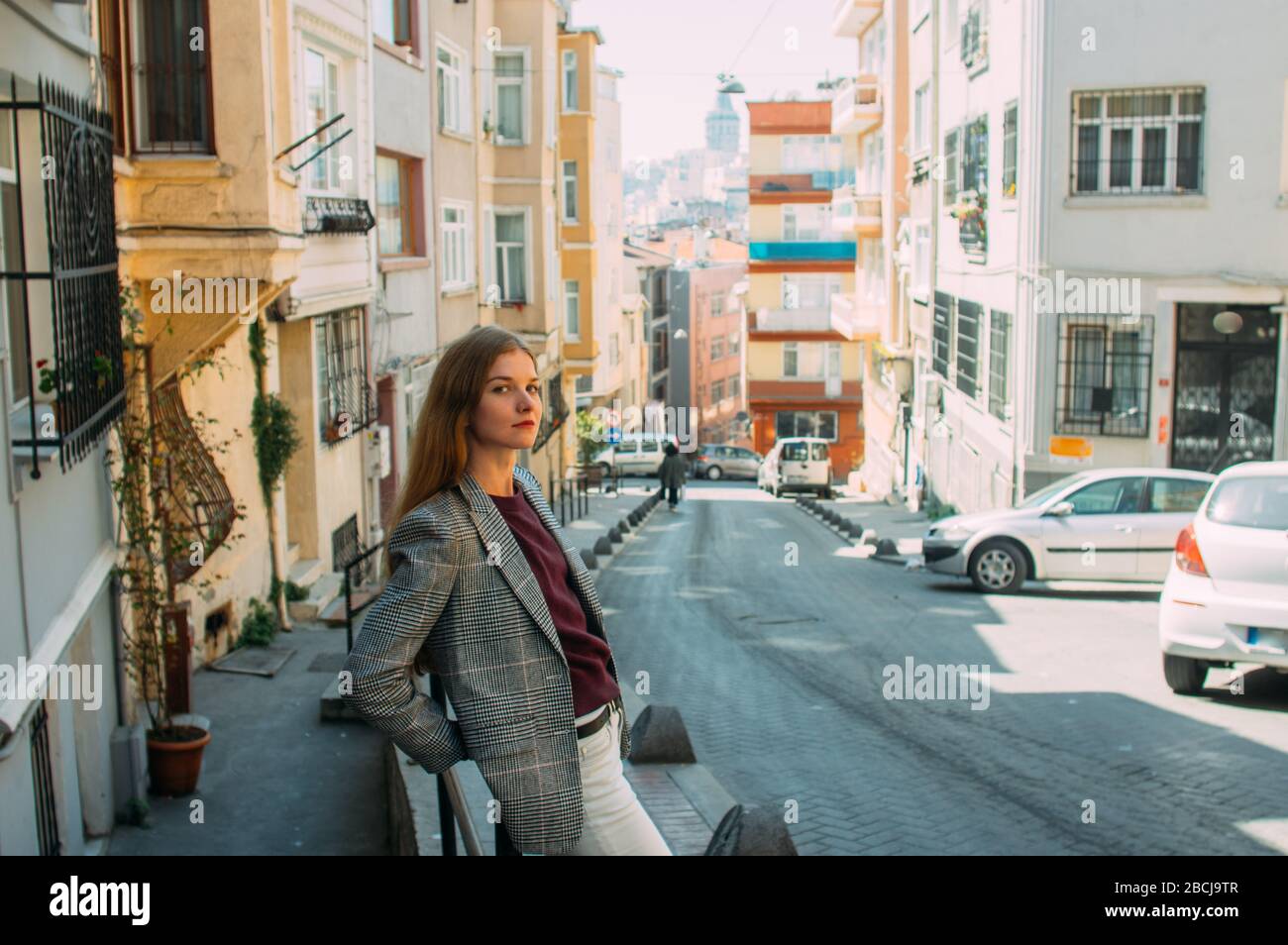 Beautiful girl with blond hair stands on old street of Istanbul, Turkey ...