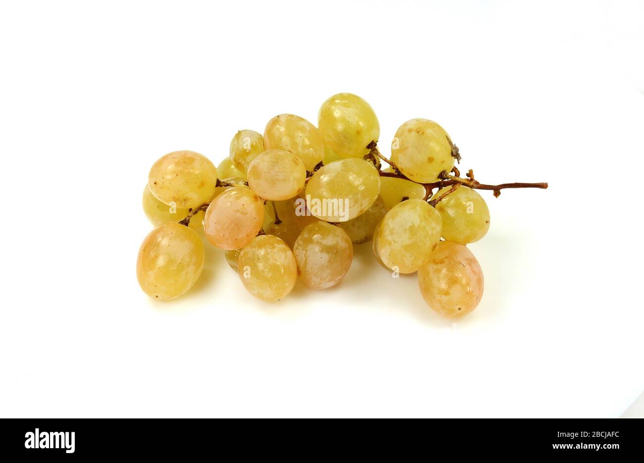 A bunch of overripe grapes isolated on white background Stock Photo - Alamy