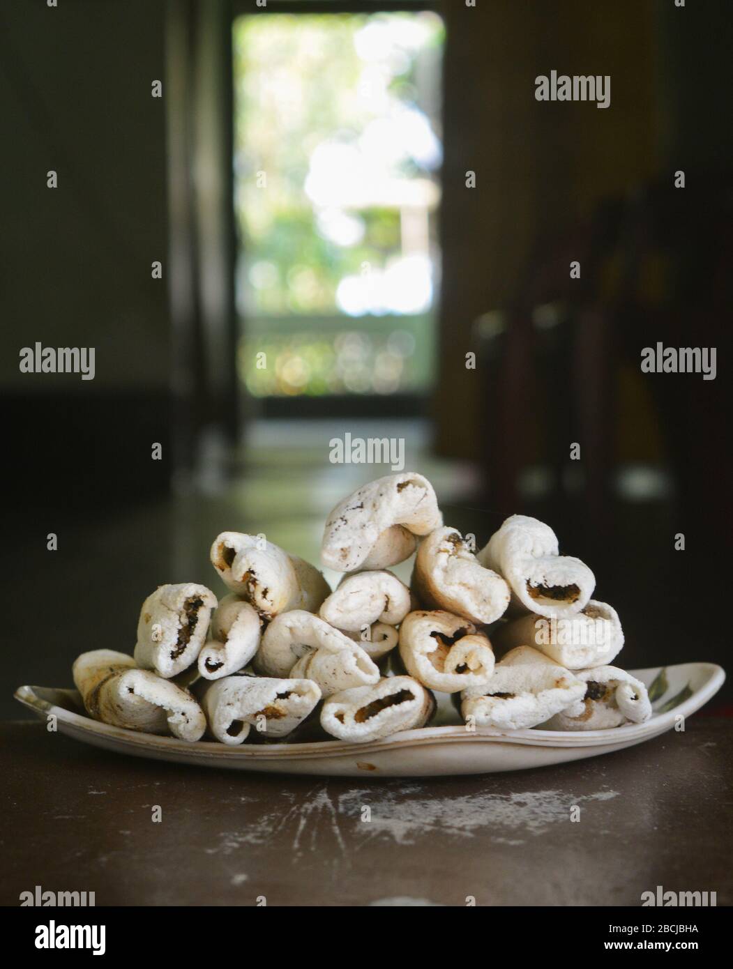 TIL PITHA, a Traditional sweet (food) of Assam Stock Photo - Alamy