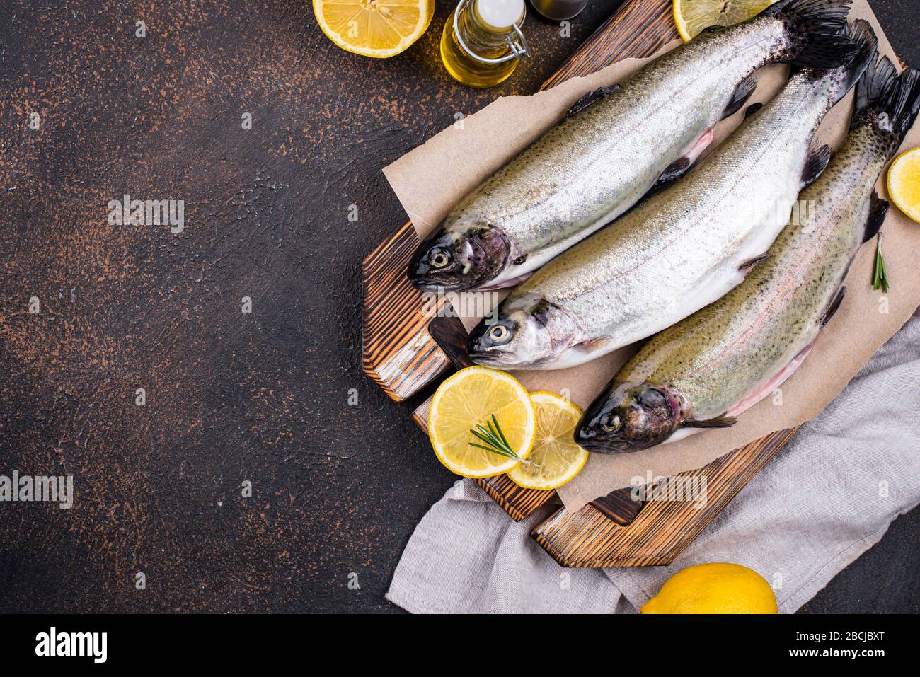 Raw uncooked trout with lemon Stock Photo - Alamy