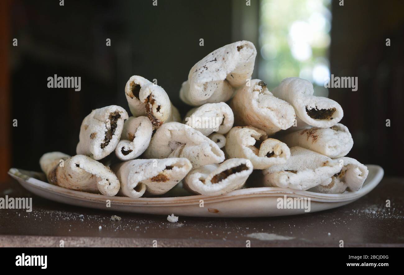 TIL PITHA, a Traditional sweet (food) of Assam Stock Photo - Alamy
