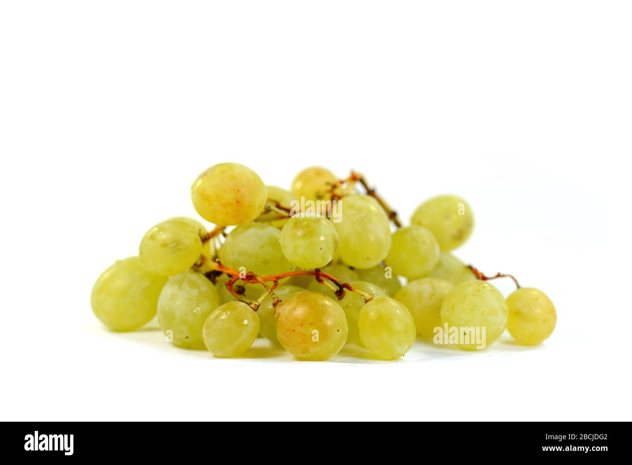 A bunch of overripe grapes isolated on white background Stock Photo - Alamy