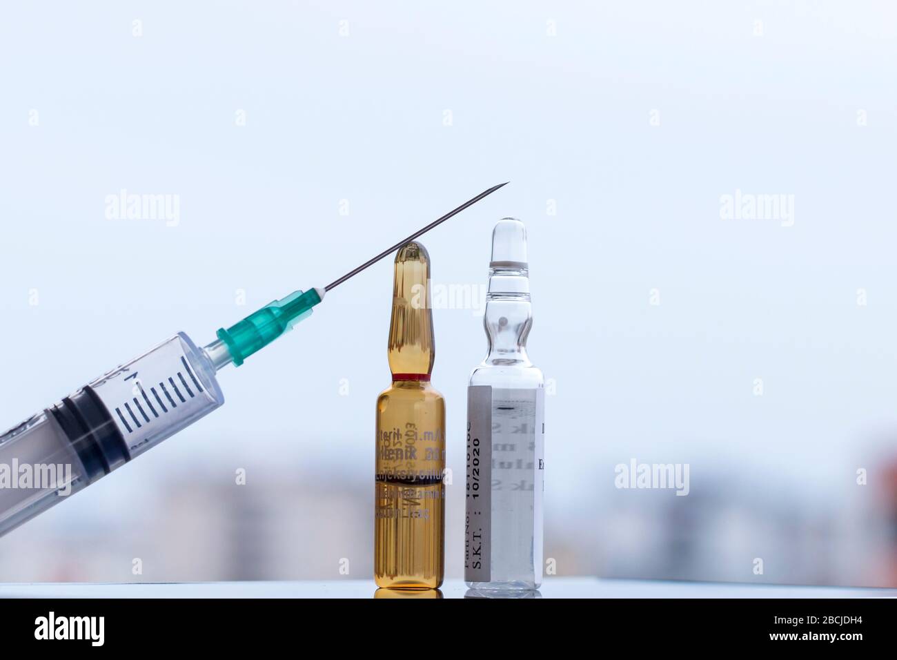 Transparent glass drug ampoule and blank background Stock Photo - Alamy