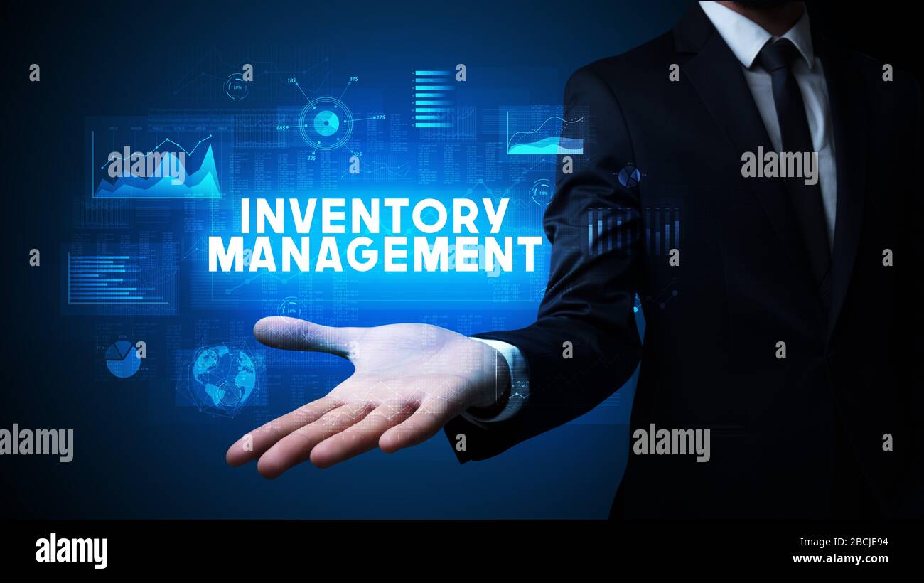 Hand of Businessman holding INVENTORY MANAGEMENT inscription, business ...