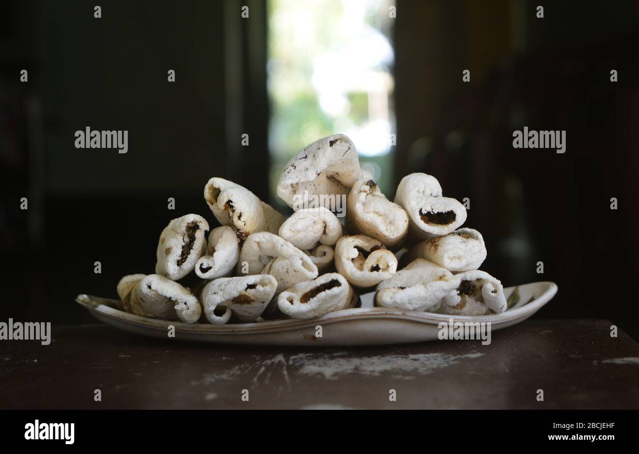 TIL PITHA, a Traditional sweet (food) of Assam Stock Photo - Alamy